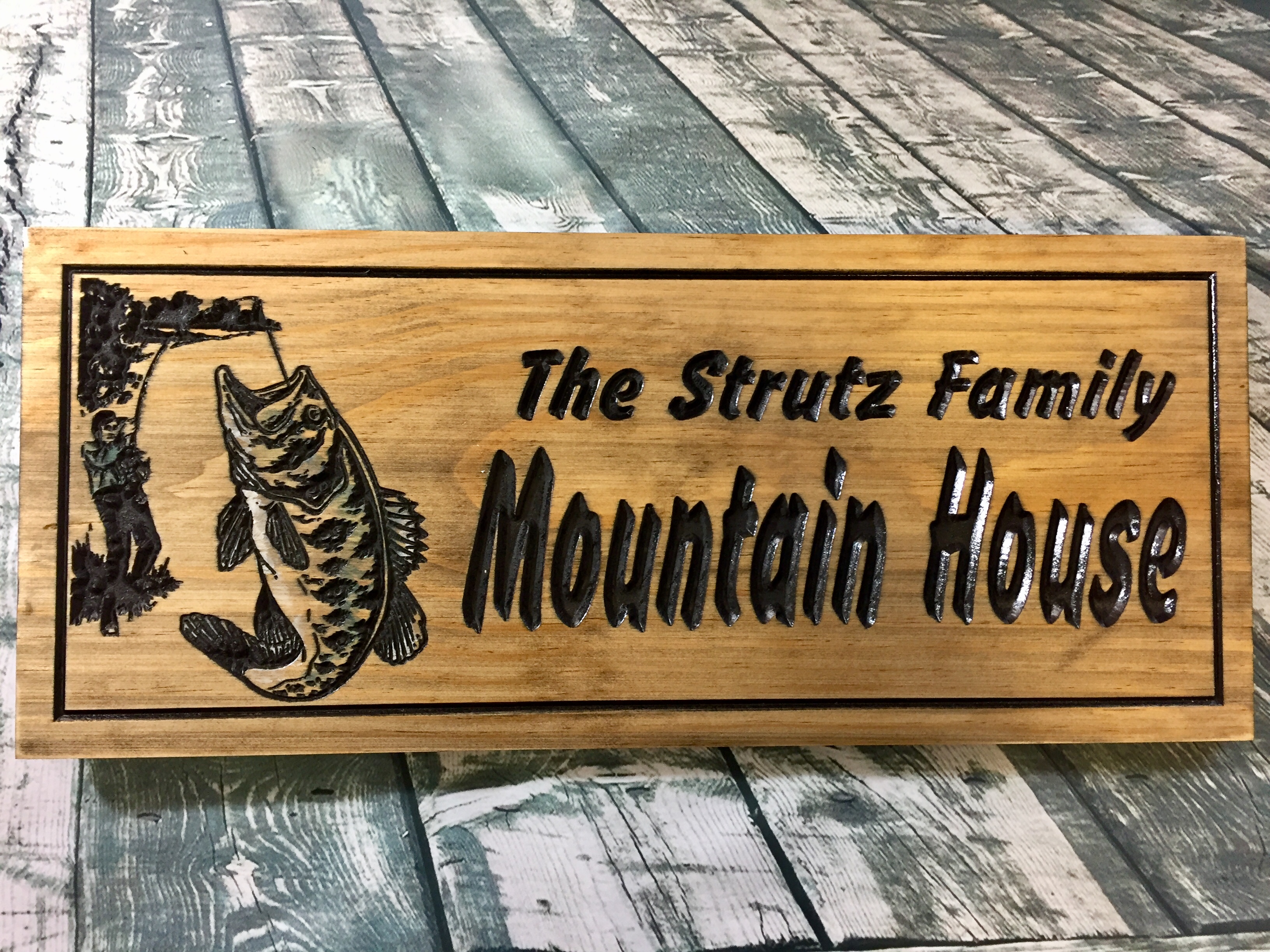 Large Mouth Bass with Fisherman Sign: benchmarksignsandgifts.com