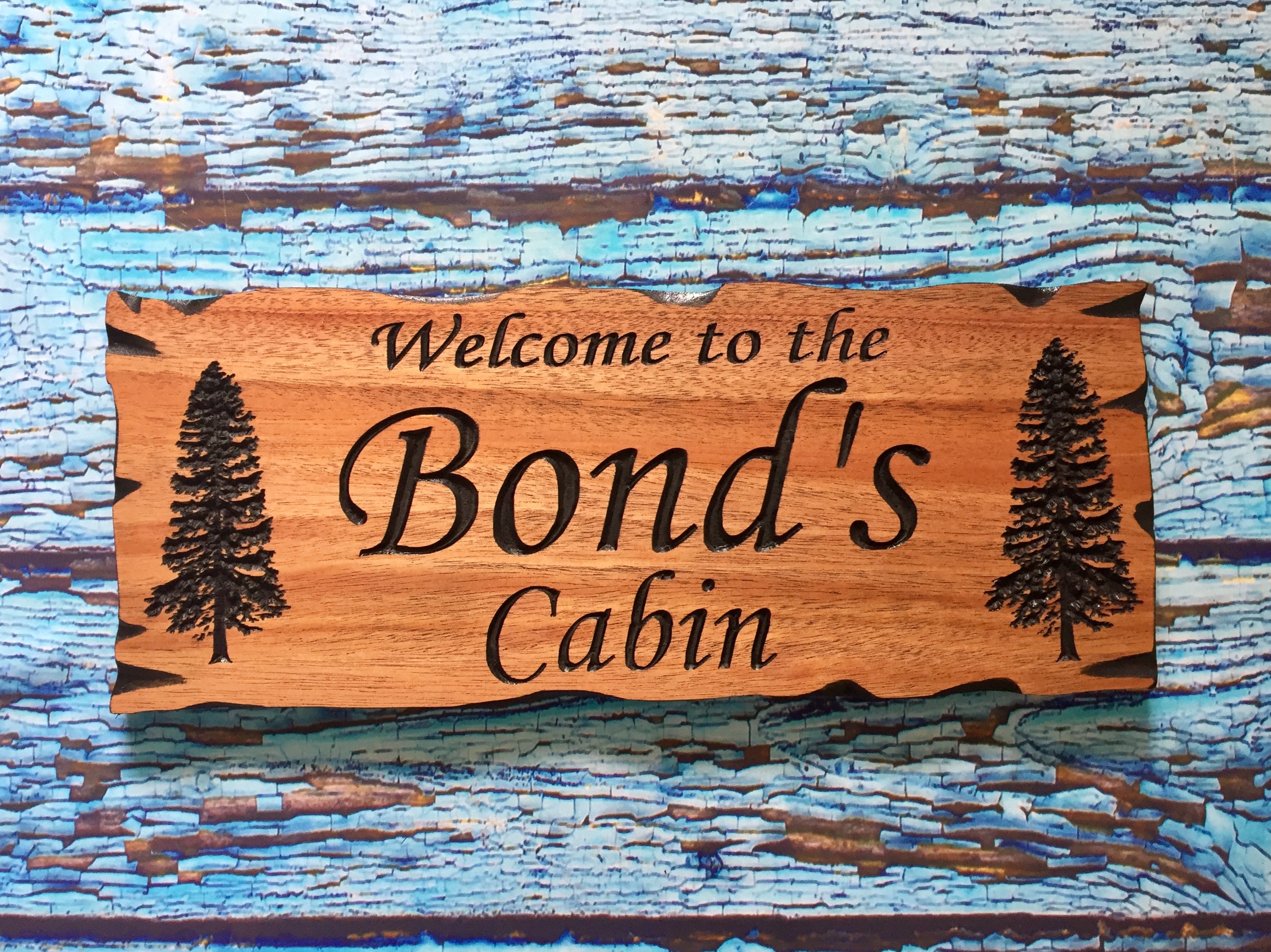 Rustic Cabin Sign With Pine Trees 2: benchmarksignsandgifts.com